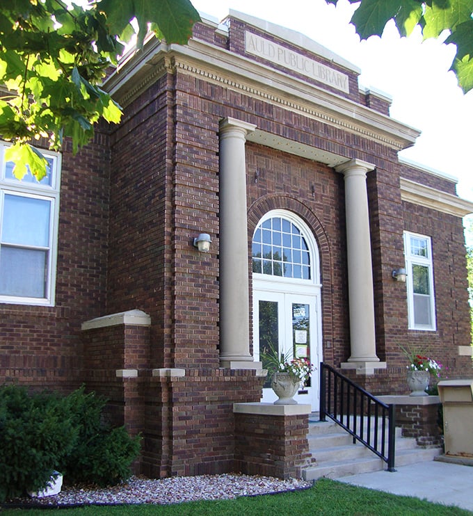 The Auld Public Library stands proud in its brick-and-mortar glory, a temple to literature that would make Willa Cather herself nod in approval.