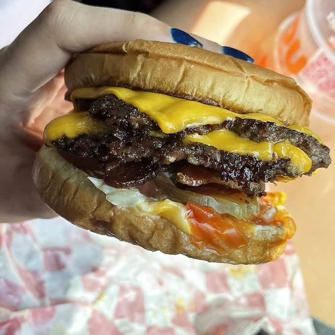 This bacon double cheeseburger isn't trying to impress your Instagram followers – it's trying to impress your taste buds. Mission accomplished.