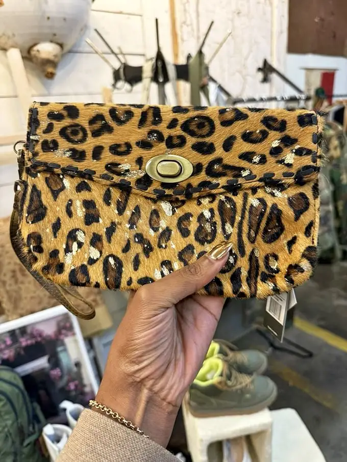 Wild side calling! This vintage leopard-print clutch proves that some fashion statements never go out of style, no matter the decade. 