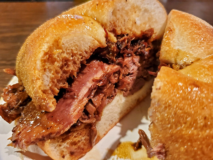 This isn't just a sandwich—it's a masterpiece of meat architecture, with perfectly pink roast beef nestled in a roll that's seen the jus.