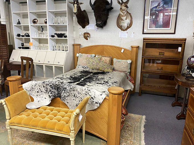 Sleep like a Rockefeller on this vintage bed setup. The cowhide throw says "I ranch," while the velvet bench whispers "but I have taste."