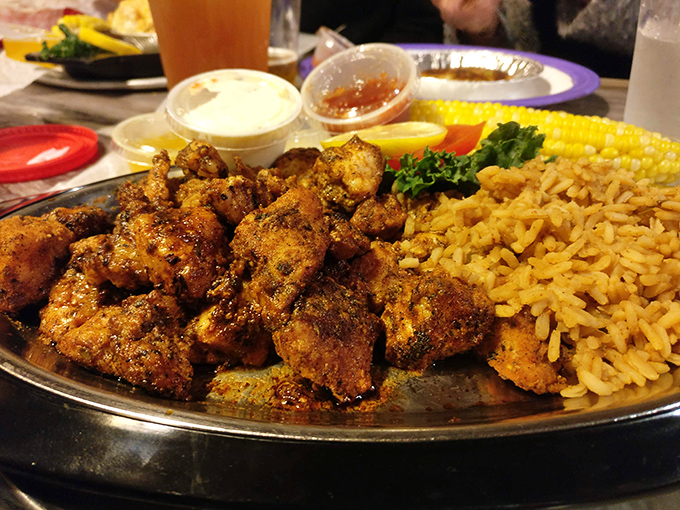 Blackened gator bites – where Florida's most famous reptile meets its delicious destiny alongside golden rice and sweet corn.