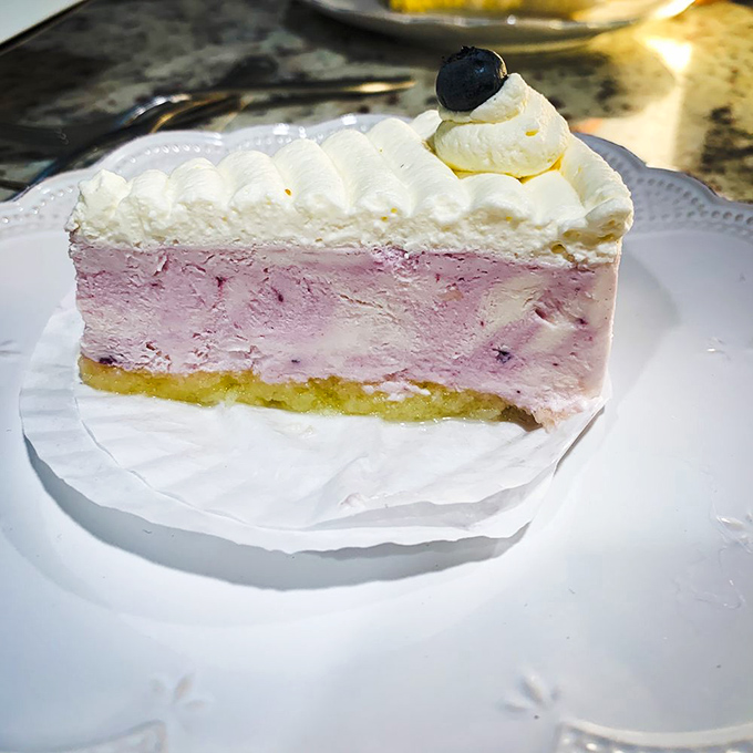 This blueberry cheesecake doesn't just satisfy a craving—it creates a new one. The triple-layer masterpiece combines creamy, fruity, and buttery in perfect harmony.
