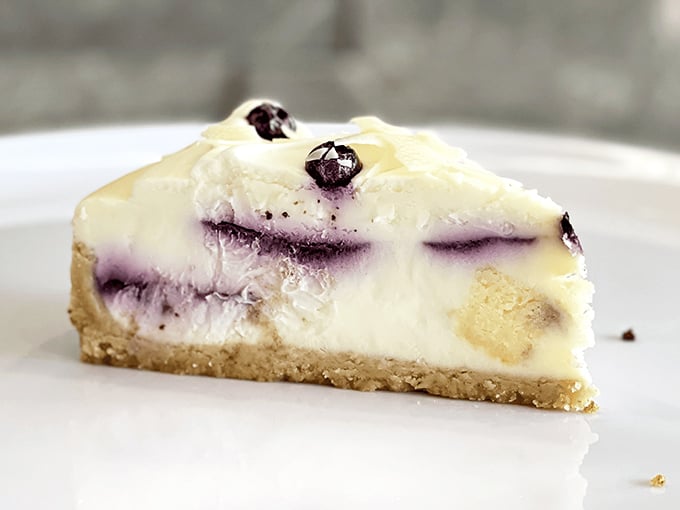 This blueberry cheesecake doesn't just have swirls—it has stories to tell, with each purple ripple promising a different level of bliss.