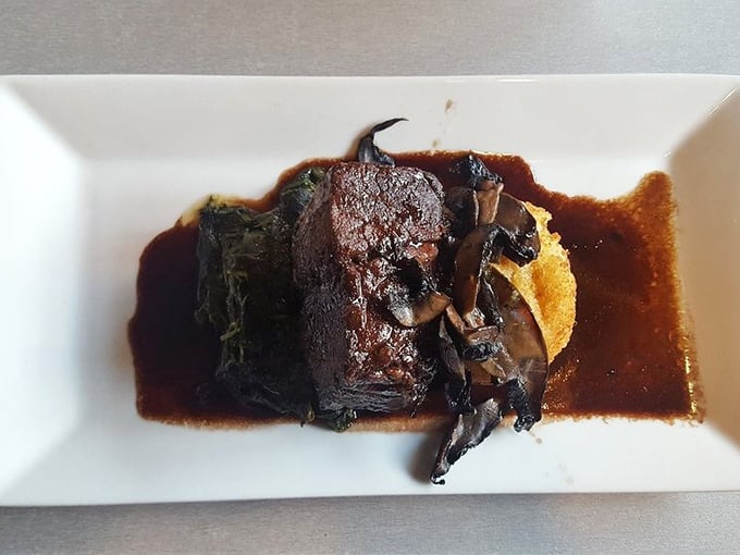 The short ribs don't just fall off the bone – they practically leap onto your fork, swimming in a sauce so rich it could buy a yacht.