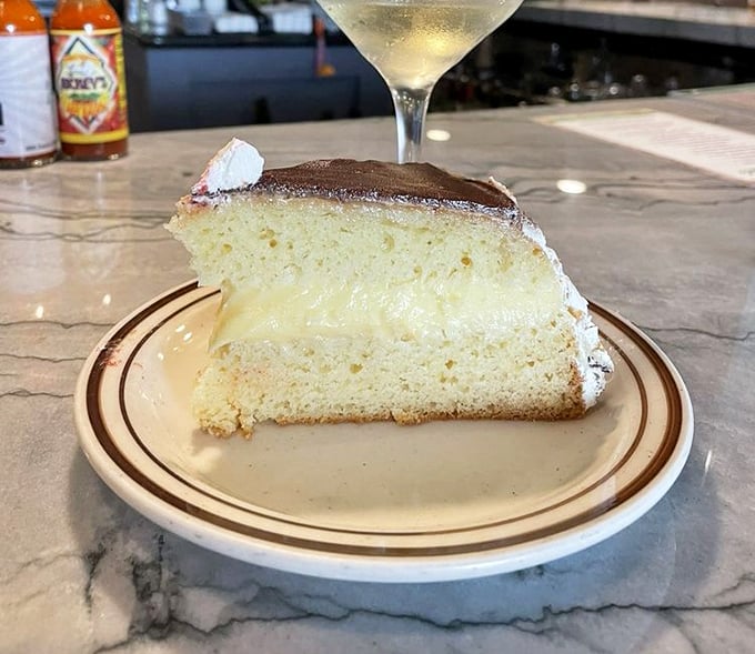 The legendary Boston cream pie in its natural habitat. That custard-to-cake-to-chocolate ratio is what mathematicians call "the golden delicious ratio."
