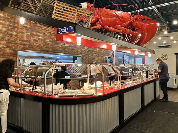This buffet line isn't just a food station—it's where dreams come true, complete with that magnificent red sentinel keeping watch overhead.