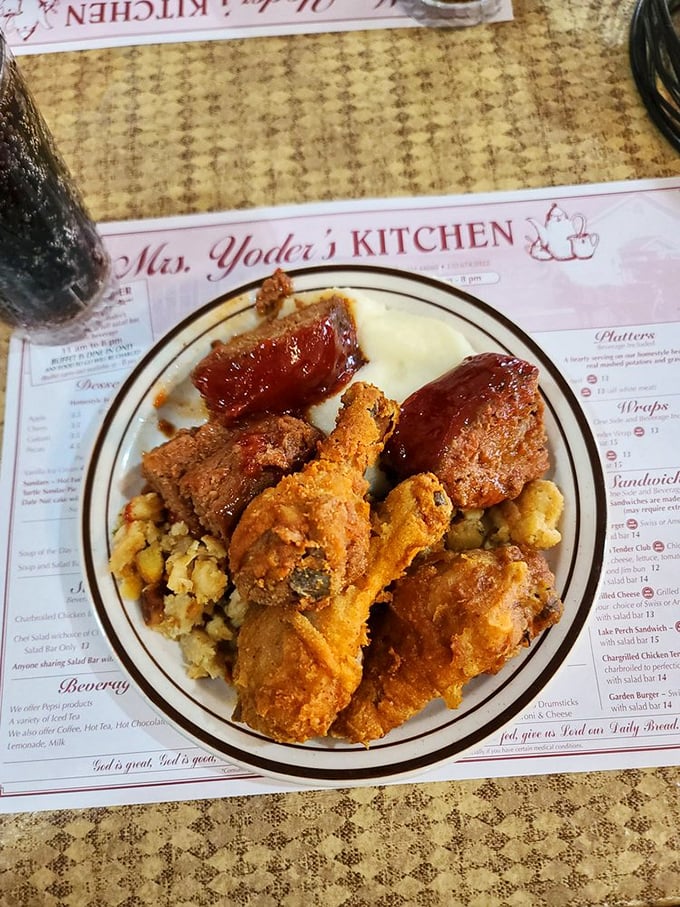 Behold the holy trinity of comfort: golden fried chicken, savory meatloaf, and stuffing that would make your grandmother both proud and jealous.
