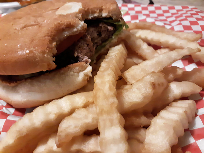 That burger isn't just a meal, it's an event—paired with those legendary hand-cut fries that somehow manage to be both crispy and fluffy in perfect harmony.
