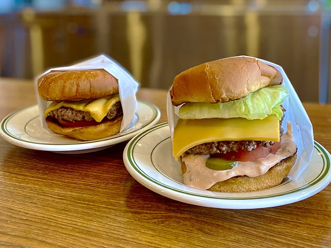 These aren't Instagram-bait burgers; they're the real deal—hand-formed patties with that perfect char, dressed simply and served with zero pretension.
