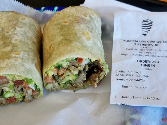 This isn't just a burrito—it's edible architecture. Notice how the cross-section reveals perfect ingredient distribution, the hallmark of burrito brilliance.