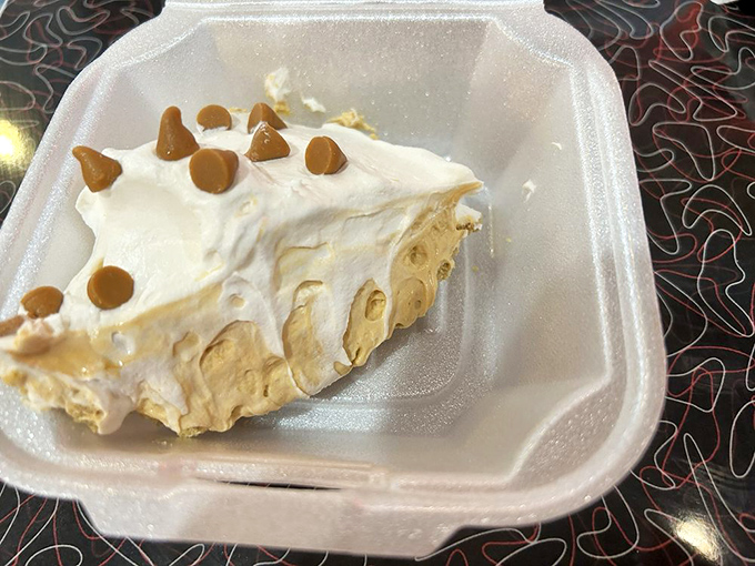 Butterscotch pie that doesn't just satisfy a sweet tooth—it creates a lifelong addiction. That cloud of whipped cream deserves its own zip code.