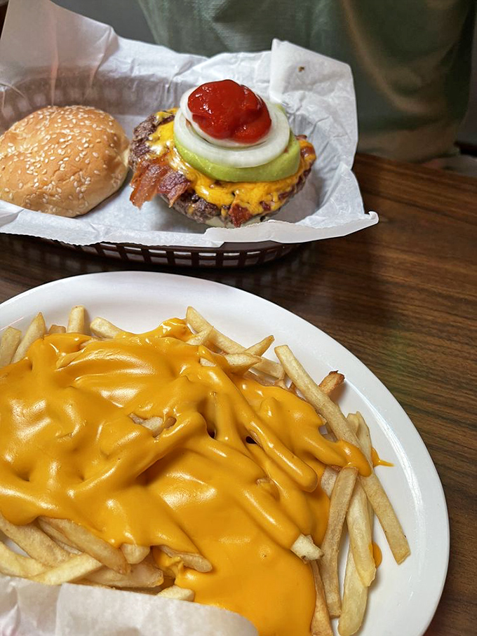 Cheese fries that don't mess around. That molten yellow blanket isn't just for show—it's the comfort food equivalent of a warm hug on a plate.