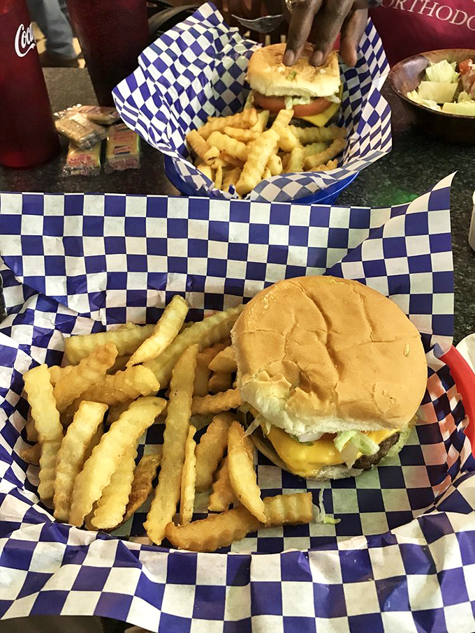 A proper diner cheeseburger doesn't need fancy frills—just a perfectly toasted bun, melty cheese, and a basket of crispy fries to complete the symphony.