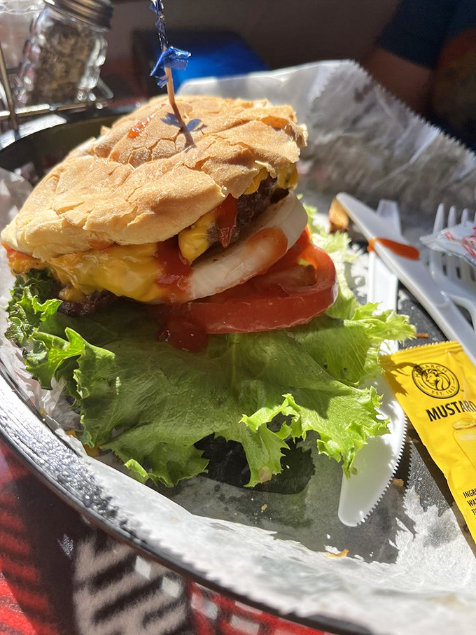 This isn't just a cheeseburger—it's a towering monument to beef perfection that requires strategic bite planning and zero shame.
