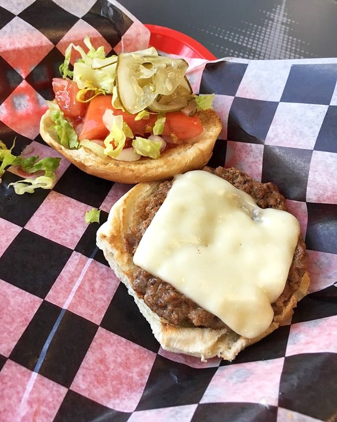 Behold the hero of our story—a perfectly melted cheese blanket hugging a seasoned patty. This isn't just lunch; it's an edible hug.