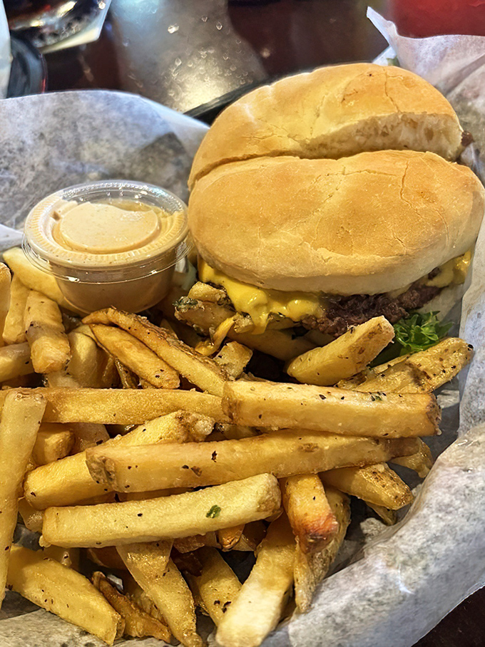 This isn't just a cheeseburger; it's a masterclass in simplicity. The golden fries aren't sidekicks—they're co-stars in this delicious production.