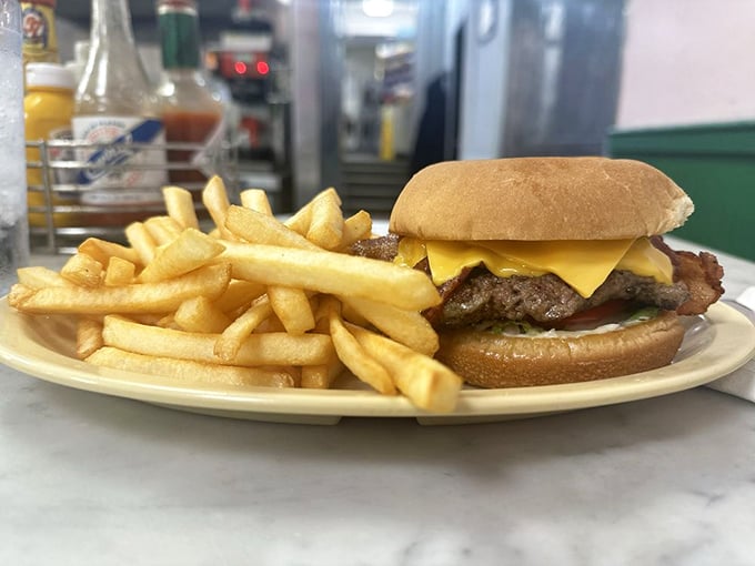 The burger that launched a thousand food pilgrimages—simple, unpretentious, and exactly what your doctor warned you about.
