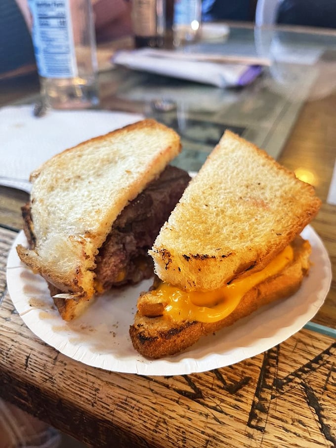 Burger architecture at its most honest—toast instead of buns, cheese that means business, and a patty cooked in a contraption that looks like it could power a steam locomotive.