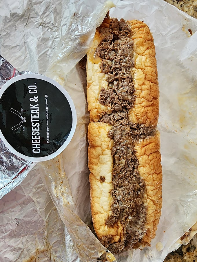 Behold the star of the show – thinly sliced beef nestled in a perfectly crusty-yet-soft roll, with every bite promising a journey to Philadelphia.