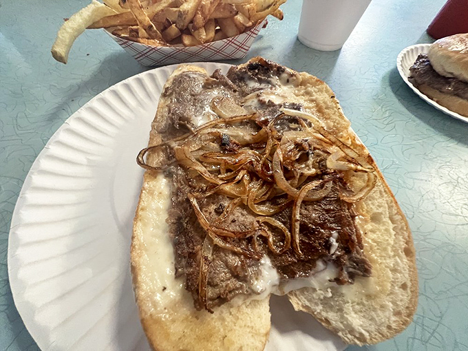 A proper cheesesteak isn't about fancy ingredients—it's about perfect balance. This beauty delivers with caramelized onions and melted cheese that binds everything in harmony.
