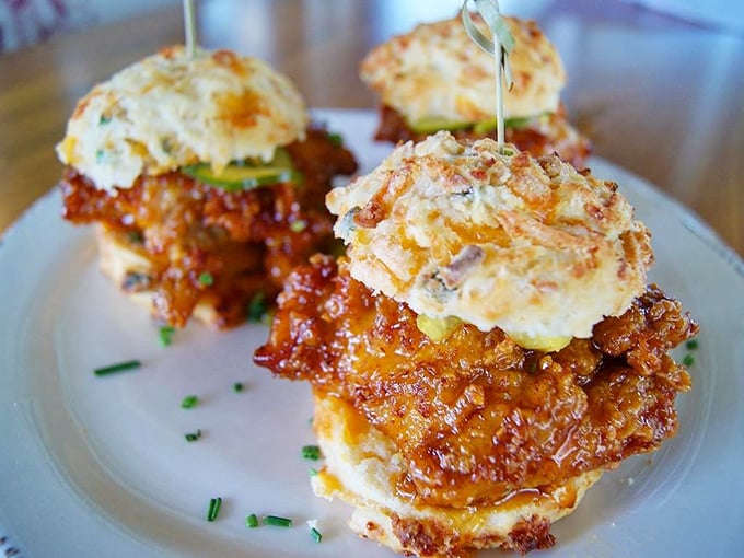 These chicken biscuits aren't just breakfast, they're an event. Golden-fried chicken nestled between fluffy biscuits—worth setting your alarm for.