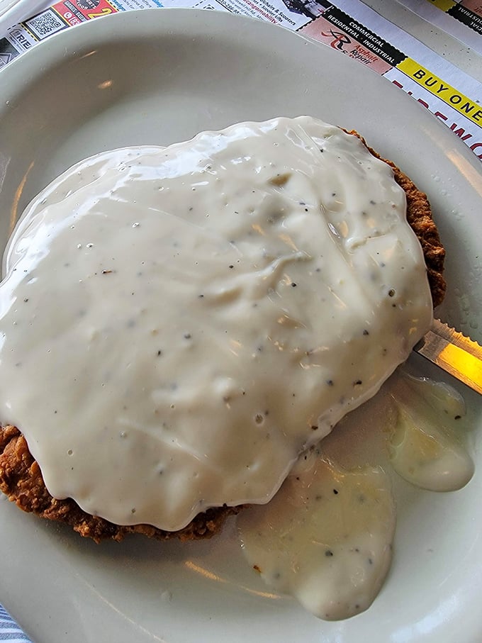 The crown jewel: chicken fried steak swimming in peppery country gravy. If clouds were savory instead of sweet, this is exactly what they'd taste like.