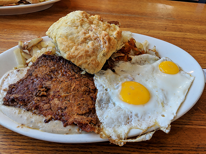 Chicken fried steak with sunny-side-up eggs and a biscuit—the holy trinity of diner breakfasts. Crispy, savory, and unapologetically indulgent.