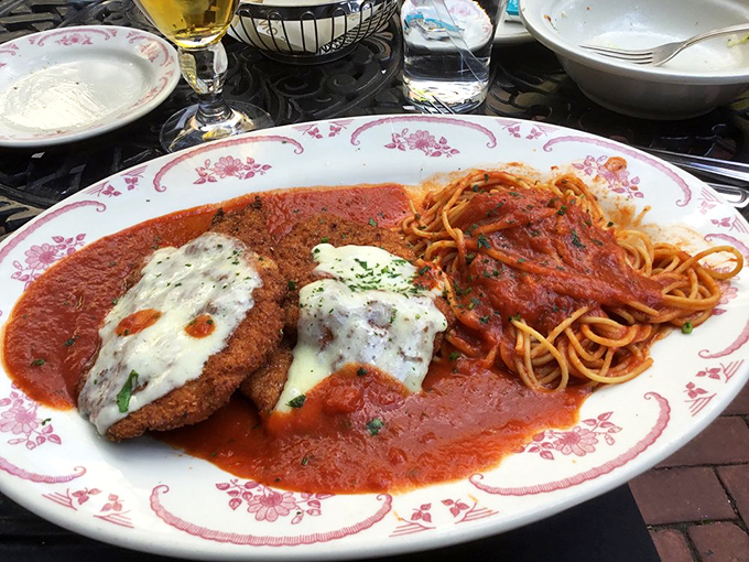 Behold the star of our show: chicken parmesan that makes grown adults fight over the last bite, paired with spaghetti that's practically singing opera.