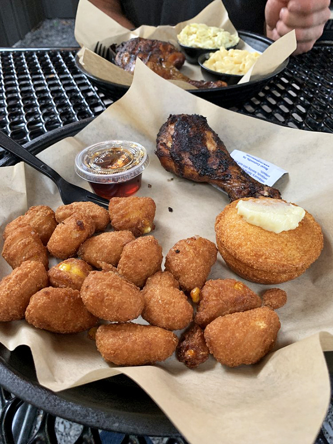 Crispy corn fritters and smoky chicken quarters create that perfect yin-yang of textures. The cornbread muffin stands by, ready for its supporting role.