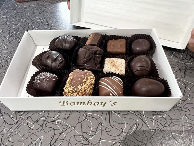 Chocolate truffles arranged with military precision, each one a commander in the army of deliciousness. The white box might as well be labeled "Instant Joy."