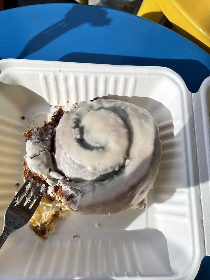 The legendary cinnamon roll in all its glory – a spiral of happiness with icing so perfect it should have its own Instagram account.