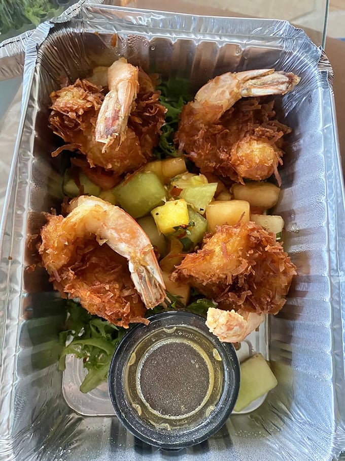 These coconut shrimp aren't your average appetizer—they're crispy little islands of joy surrounded by a sea of tropical fruit salsa.