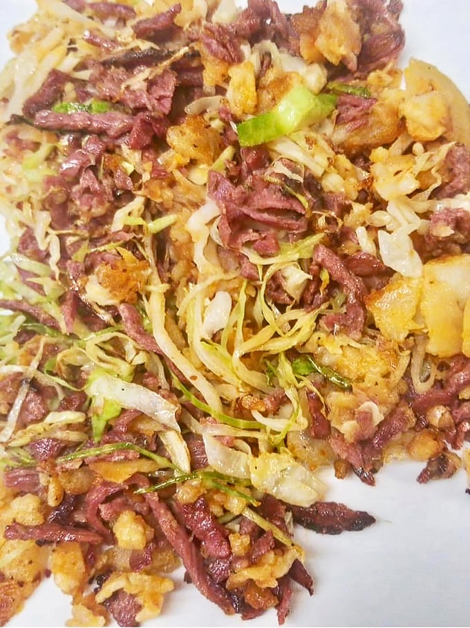 Behold the holy grail – Village Diner's famous corned beef hash, where crispy edges meet tender chunks in perfect breakfast harmony.