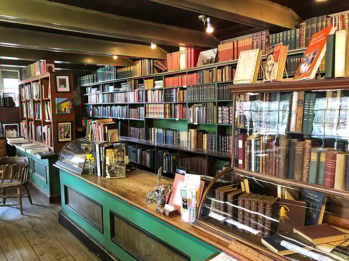 The green counters have witnessed thousands of literary transactions. Each book that crosses this surface begins a new journey.