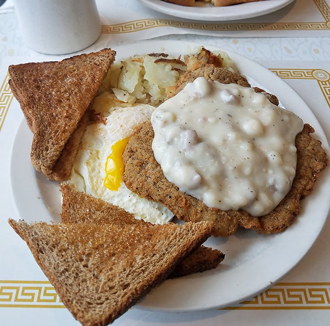 Country fried steak nirvana! That golden-brown crust gives way to tender meat while the gravy performs its creamy magic on your taste buds.
