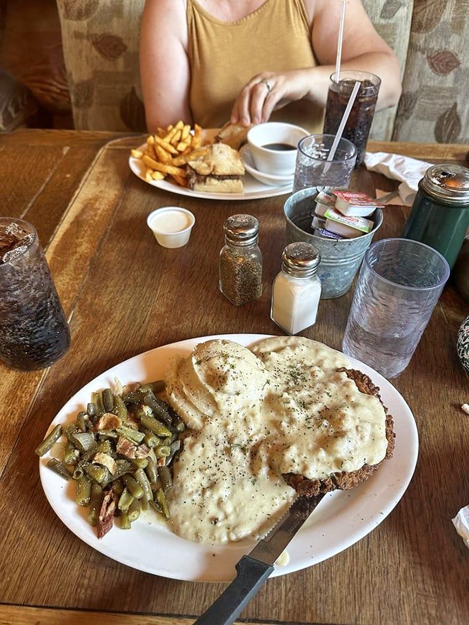 Country fried steak that deserves its own zip code – crispy exterior giving way to tender beef, all swimming in gravy that could make cardboard taste gourmet.