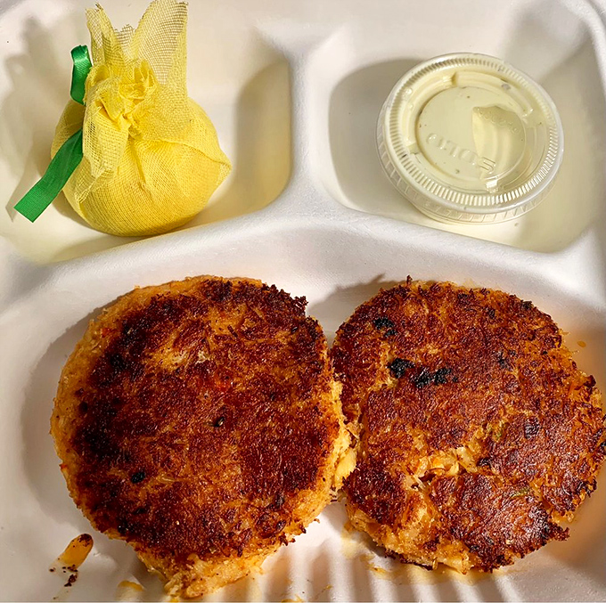 These golden-brown crab cakes aren't just fried—they're sunbathed to perfection, with a crispy exterior that gives way to sweet, delicate meat inside.