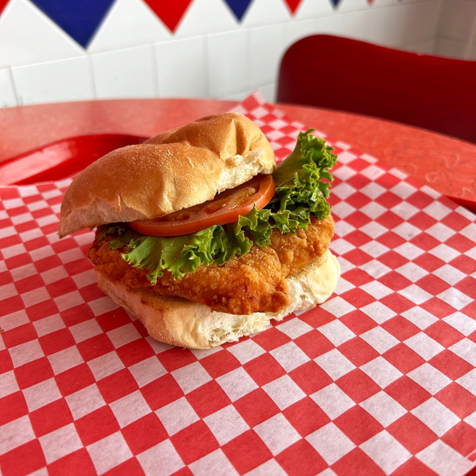 This crispy chicken sandwich doesn't just talk the talk—it walks the crunch. Golden-brown perfection nestled in a soft bun with fresh lettuce and tomato.