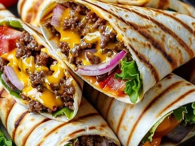 Behold the burrito of your dreams – where melted cheese meets seasoned beef in a tortilla embrace. This isn't just a meal; it's a hand-held masterpiece.
