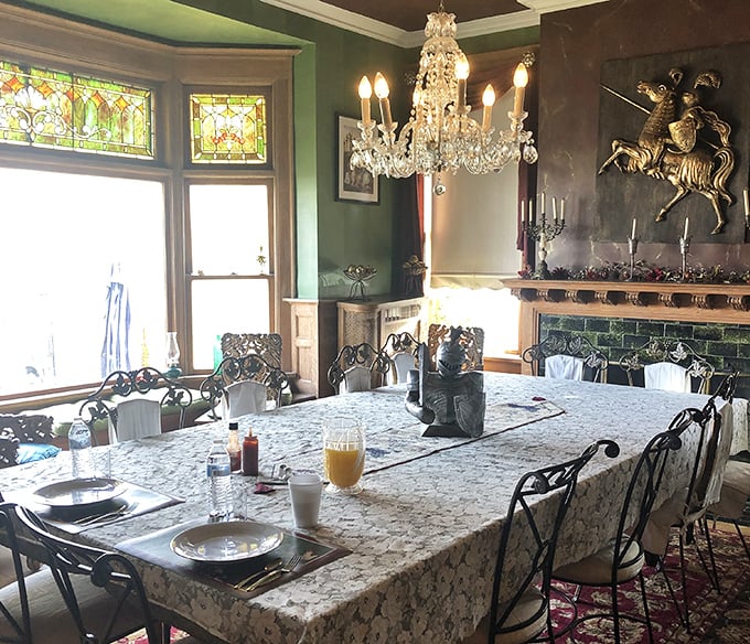 Breakfast fit for nobility served beneath crystal chandeliers—the green walls and ornate woodwork transport you to another era entirely.