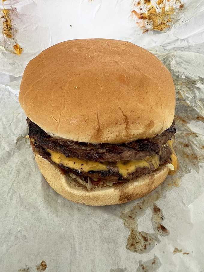 This double cheeseburger isn't trying to impress your Instagram followers – it's too busy preparing to impress your taste buds.