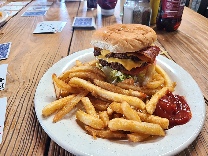 This isn't just a burger—it's edible architecture. The Marty Burger towers with bacon and cheese, surrounded by fries that demand to be savored one by one.