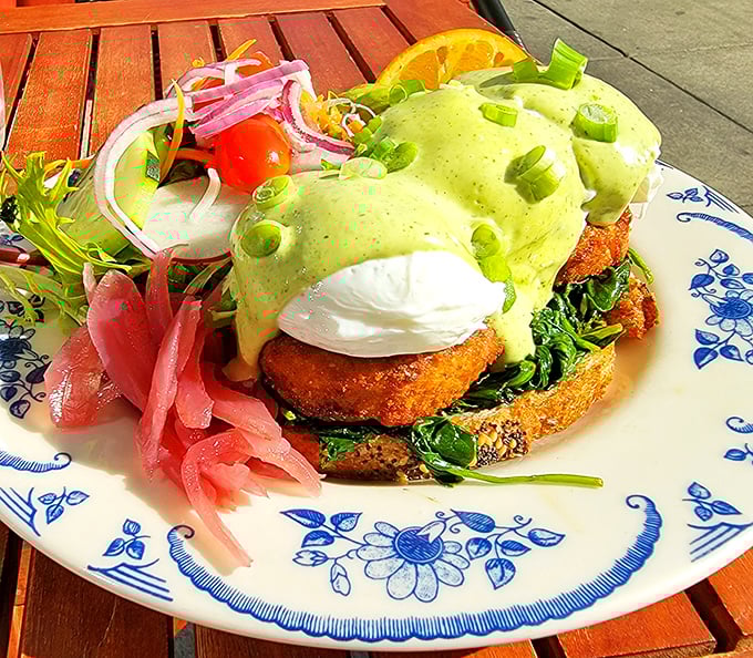 This vibrant Benedict crowned with avocado-green hollandaise isn't just breakfast – it's edible architecture designed to make your taste buds stand at attention.
