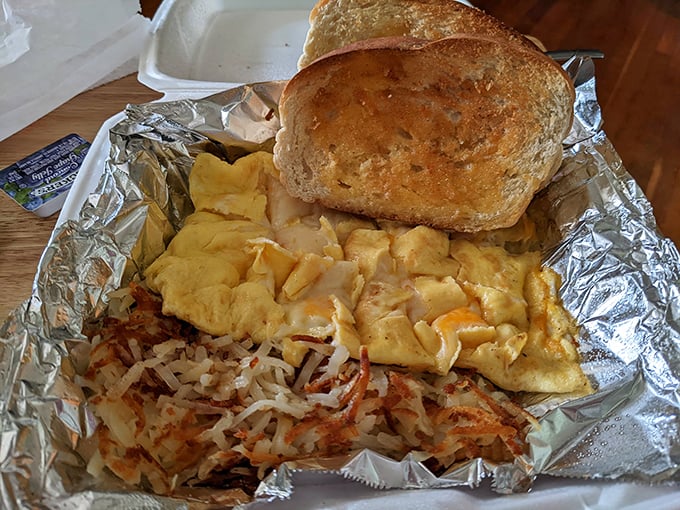 Breakfast perfection doesn't need filters – scrambled eggs, crispy hash browns, and buttery toast create the holy trinity of morning satisfaction.