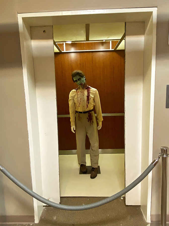 This eerie elevator display recreates a classic zombie encounter scene—thankfully, this undead passenger stays put when the doors open.