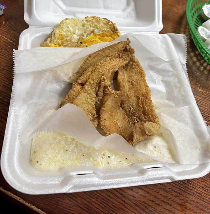 Fried fish for breakfast? In the South, that's not rebellion—it's tradition. Crispy, golden perfection paired with creamy grits creates morning magic.