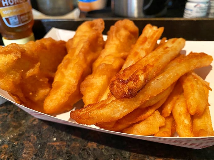 Golden fries that crunch like autumn leaves, perfectly fried to that magical point between crispy and fluffy. Carb heaven exists in Columbus.
