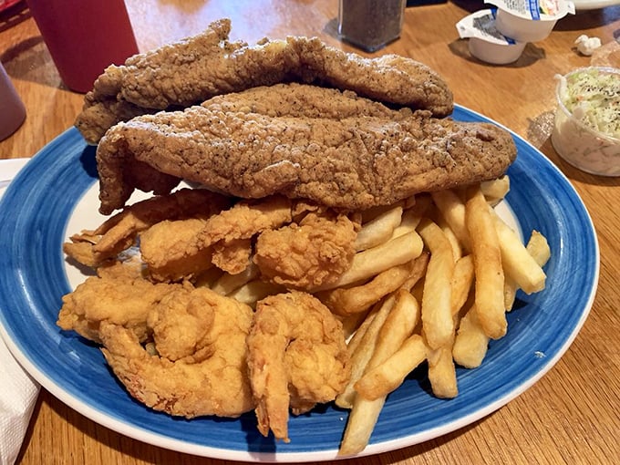 Golden-battered fish fillets lounging atop a bed of crispy fries—a plate that whispers "vacation" even on a Tuesday in landlocked Walkertown.