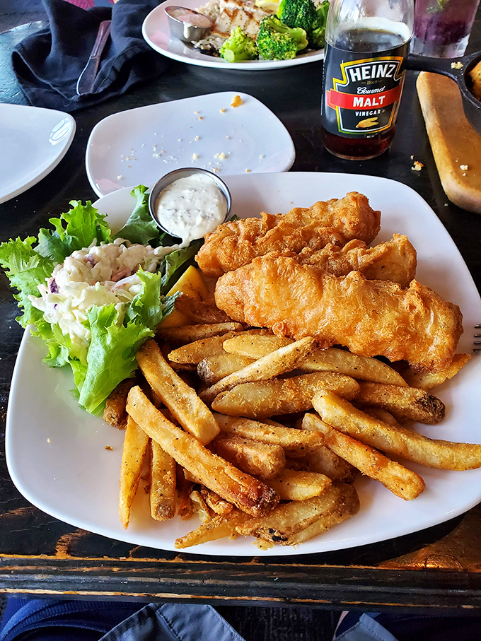 Golden-battered fish that shatters with each bite, paired with fries that could make a Brit homesick. The coleslaw's just there to make you feel virtuous.